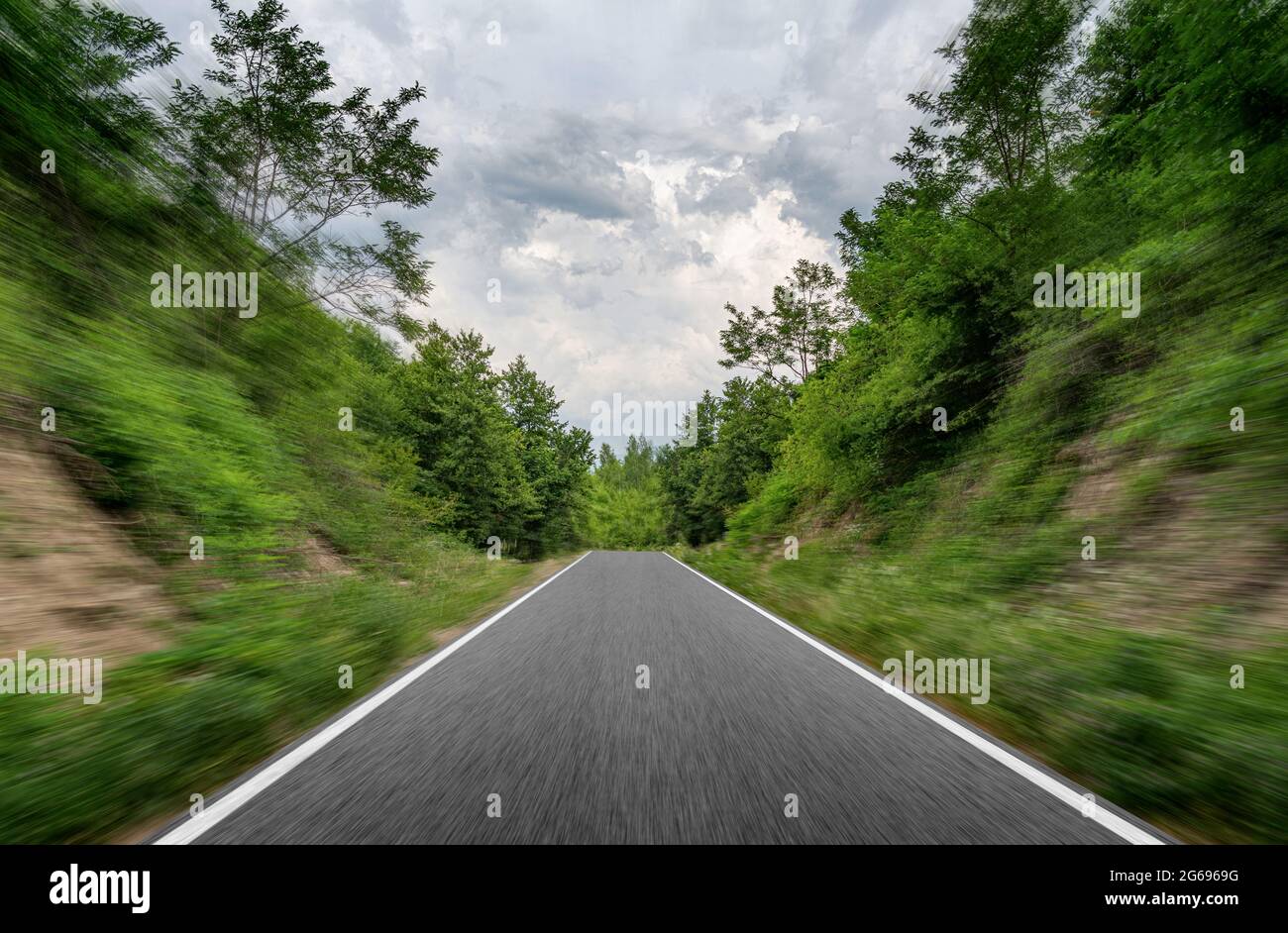 Highway among the trees Stock Photo - Alamy