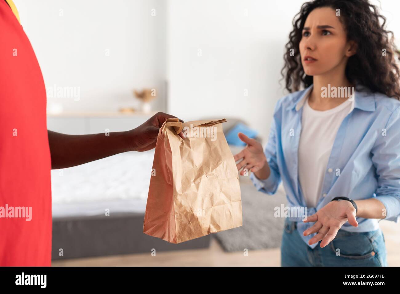 Closeup of confused woman complaining about bad food delivery Stock ...