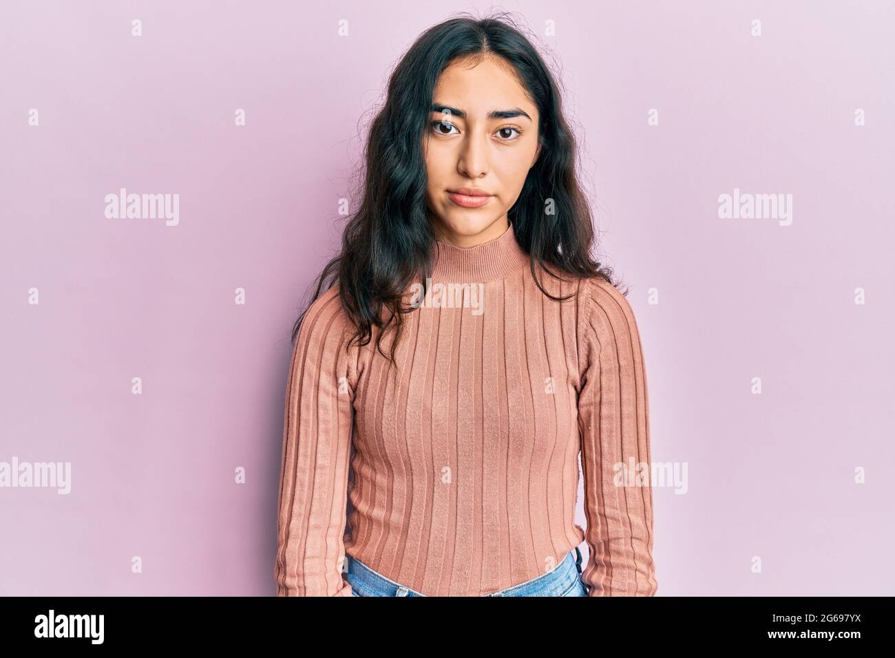 Hispanic teenager girl with dental braces wearing casual clothes with ...