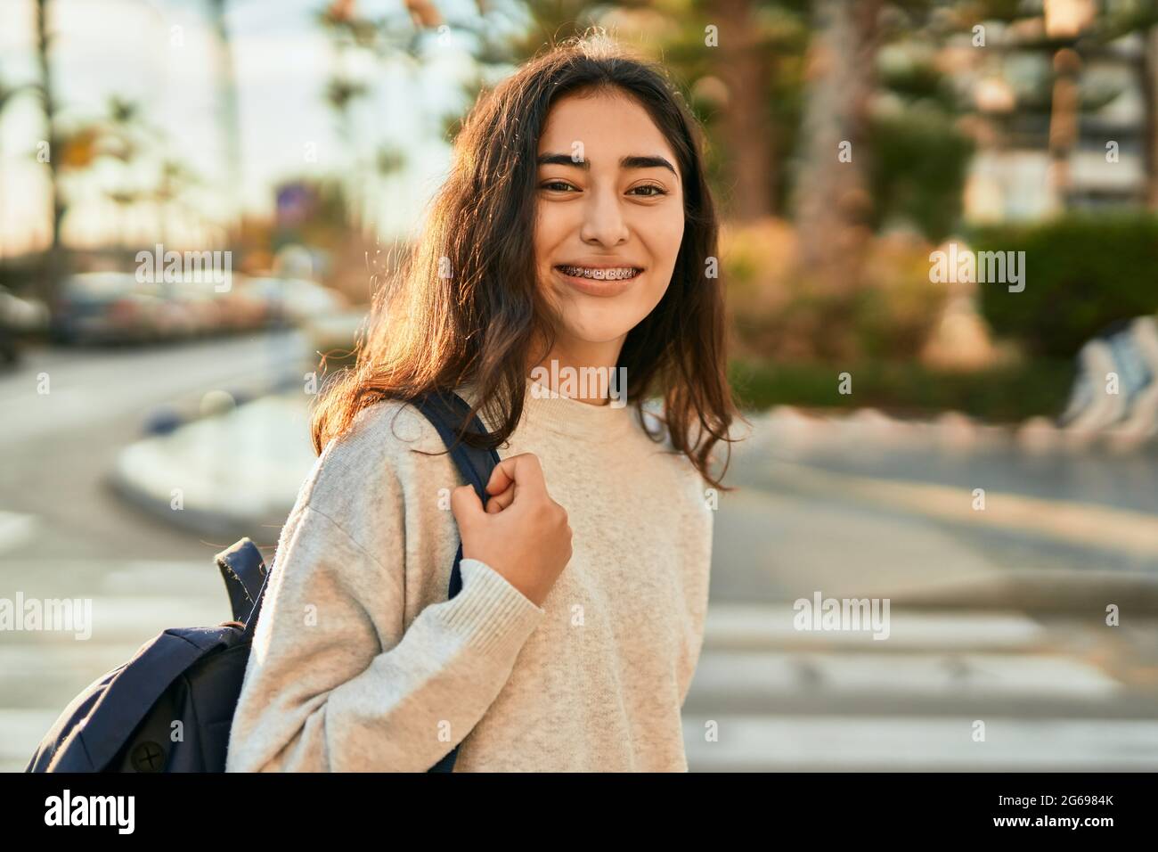 Young middle east student girl smiling happy standing at the city Stock ...