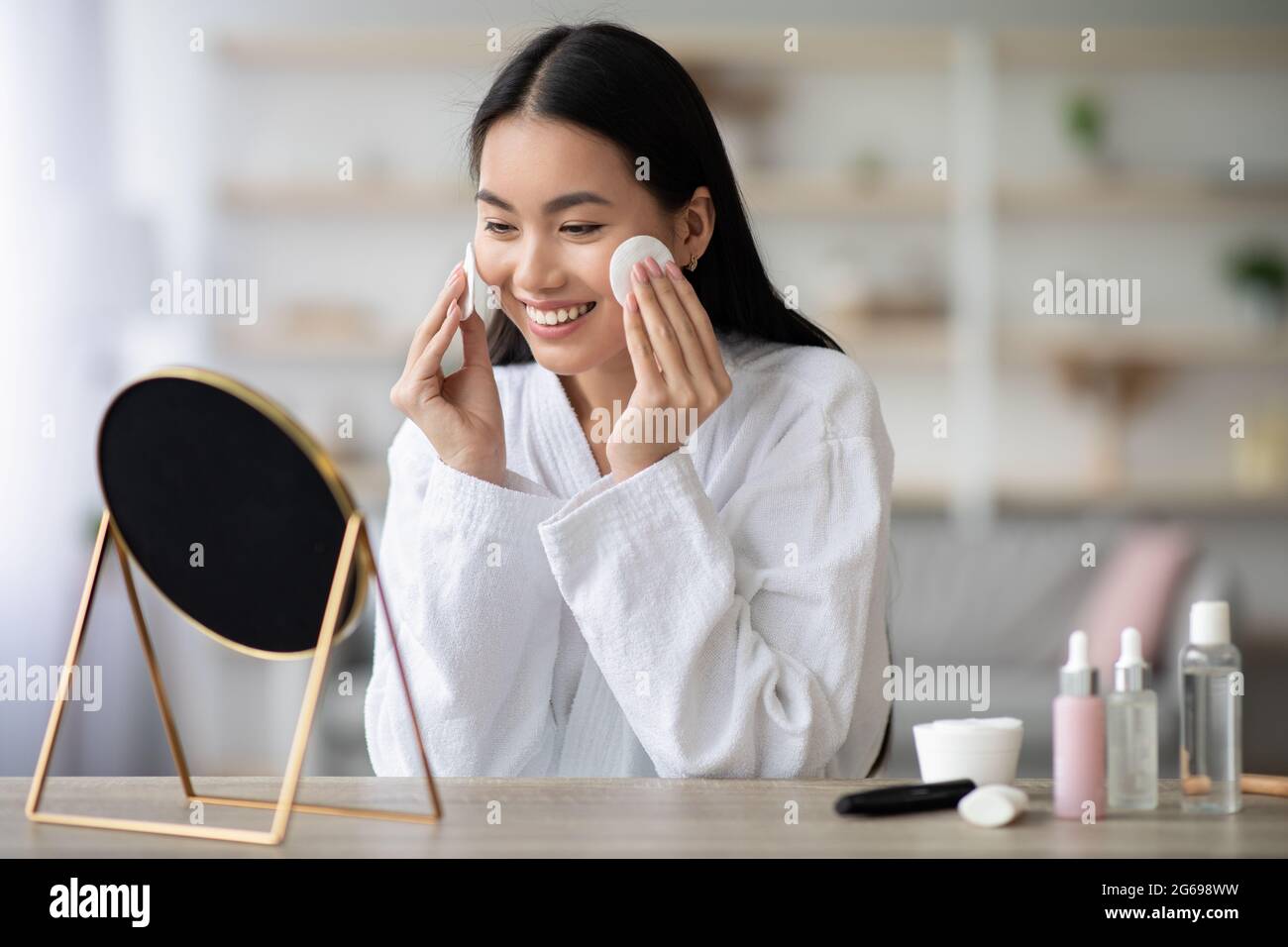 Woman applying facial toner hi-res stock photography and images - Alamy
