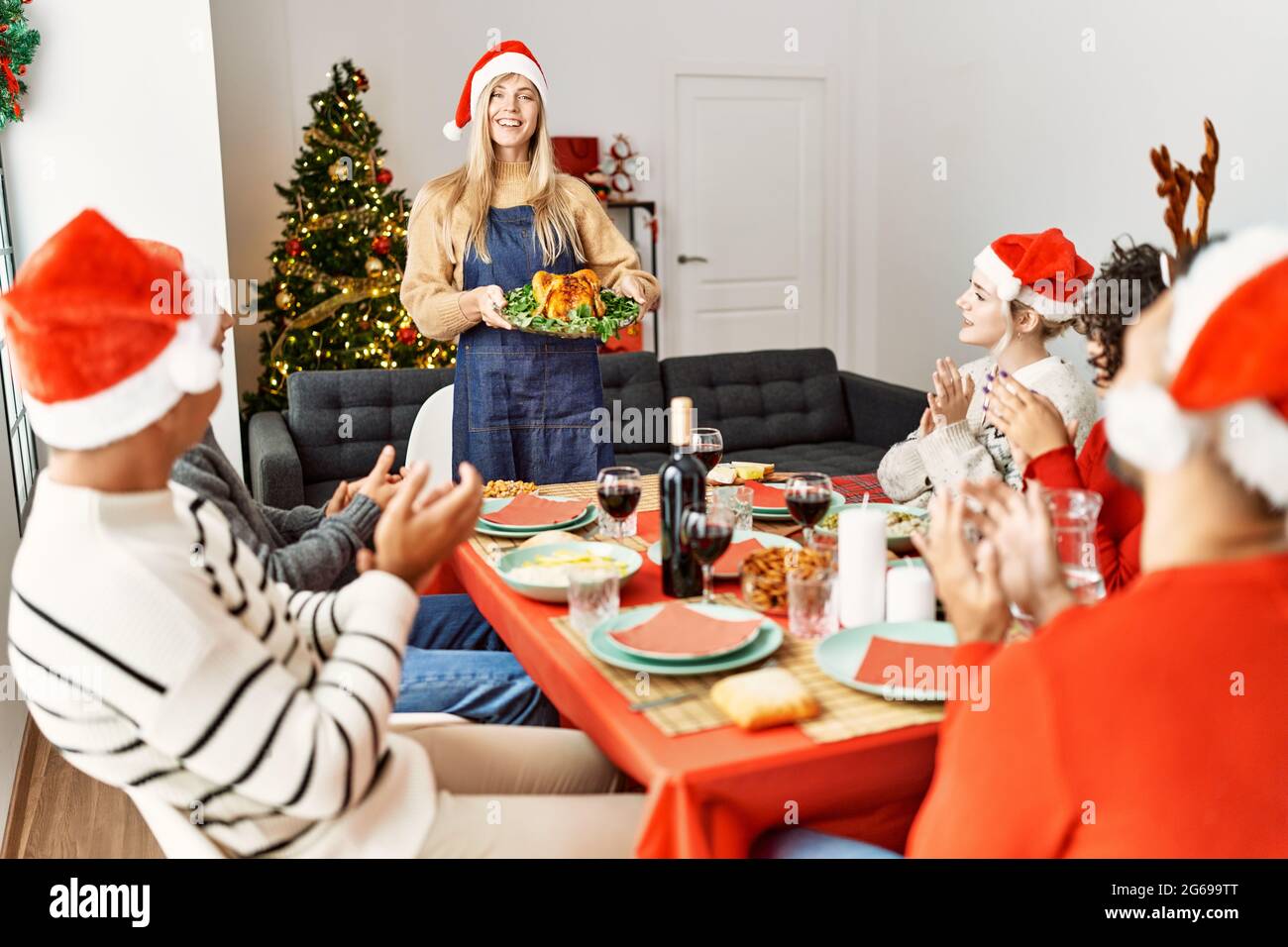 Group of people meeting clapping and sitting on the table. Woman ...