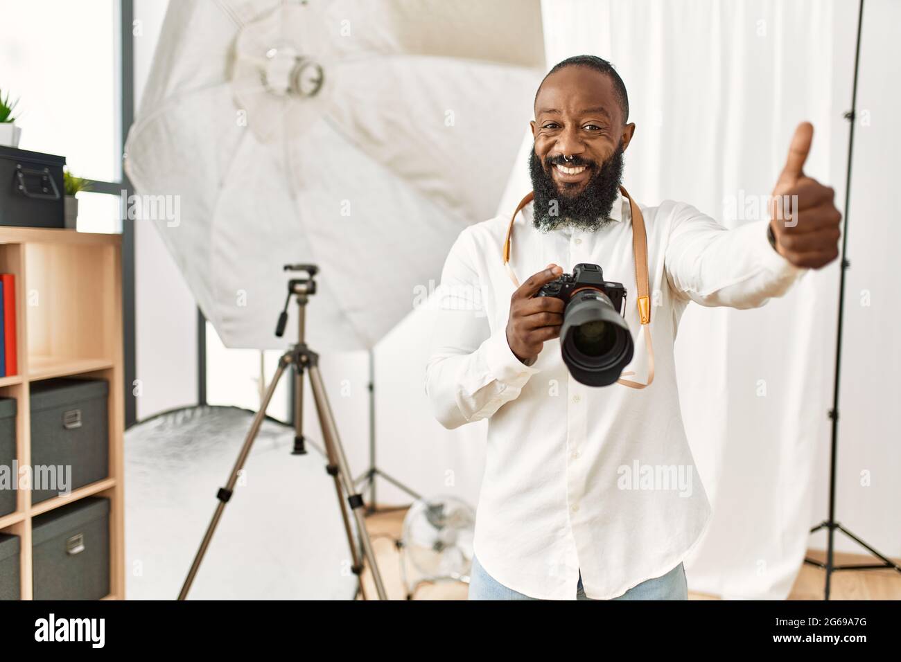 African american photographer man working at photography studio ...