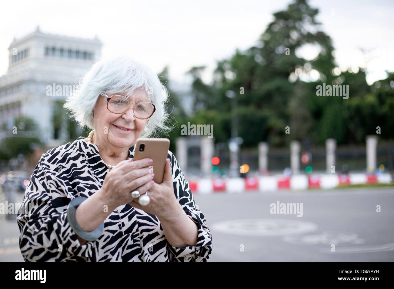 Device, older woman hi-res stock photography and images - Alamy