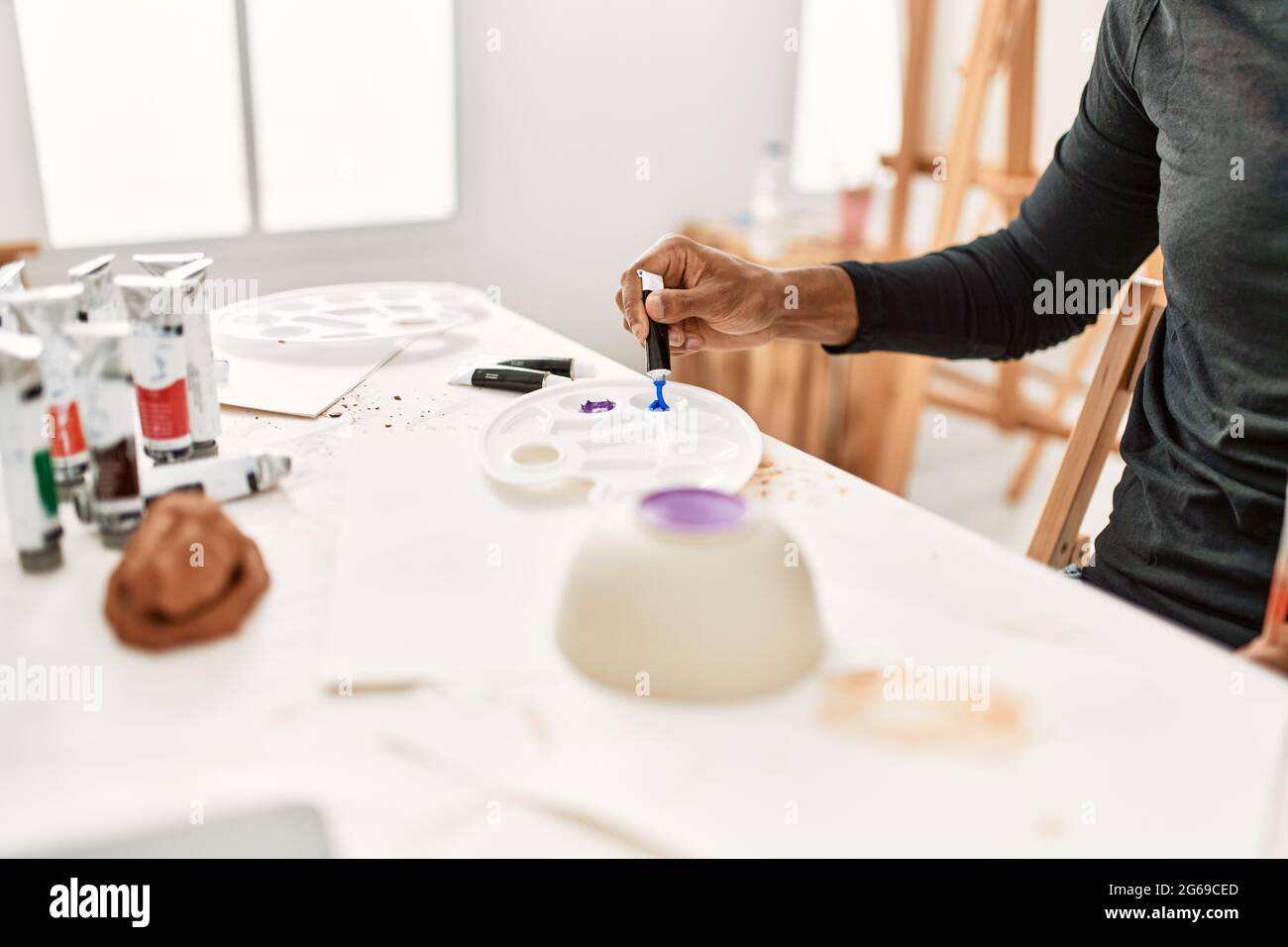 Hand of african american artist man painting at art studio Stock Photo ...