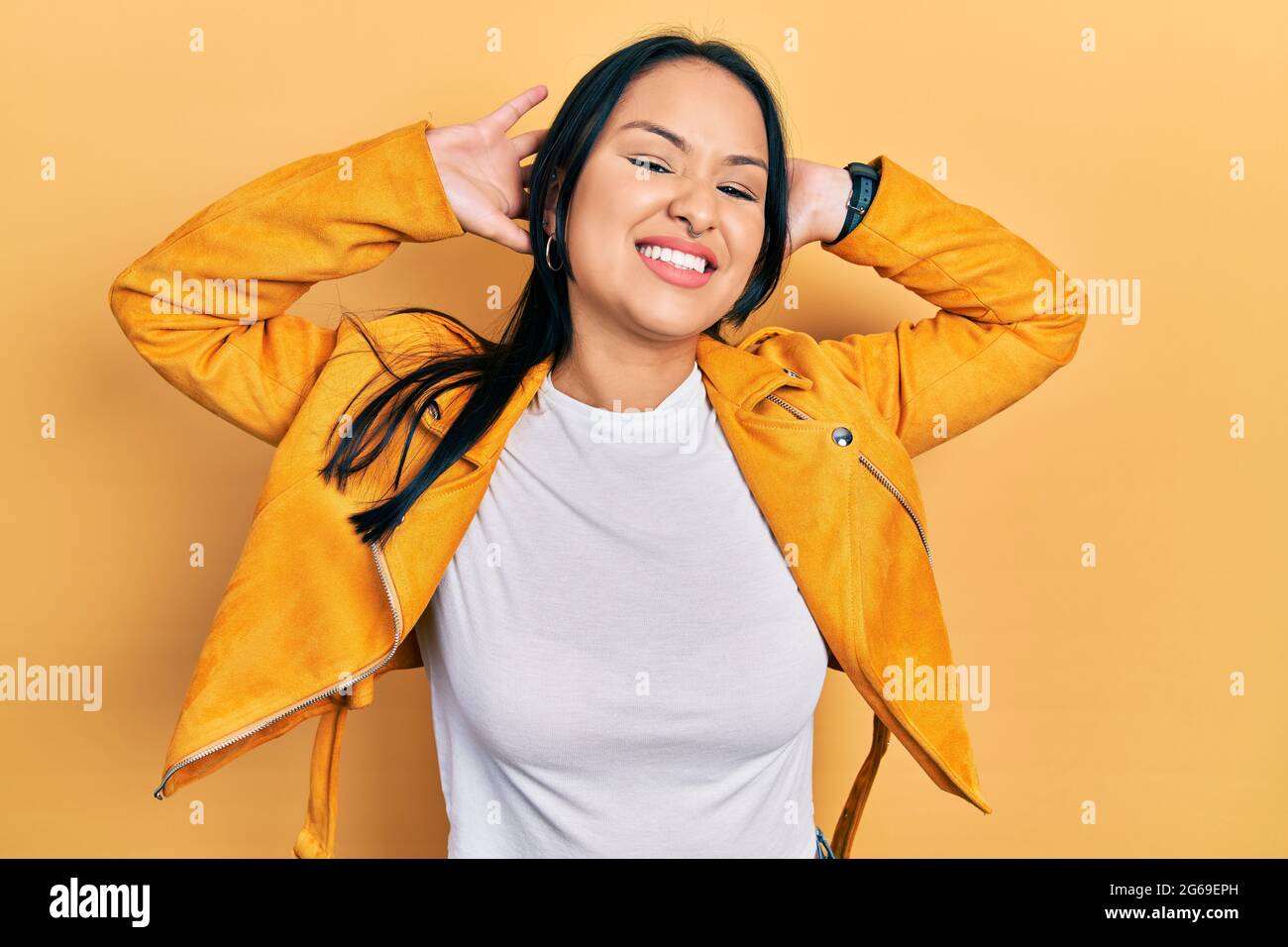 Beautiful Hispanic Woman With Nose Piercing Wearing Yellow Leather