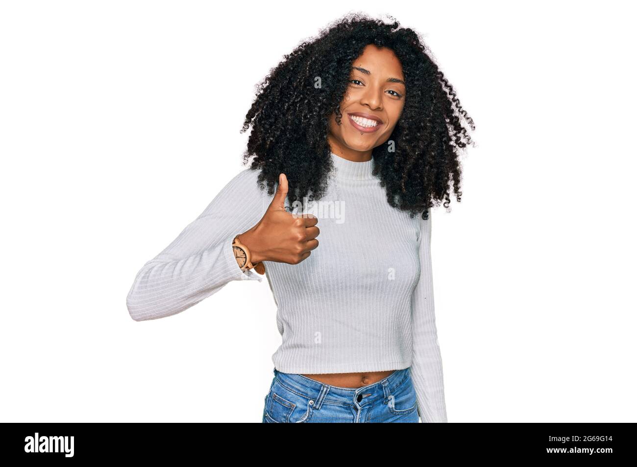 Young african american girl wearing casual clothes doing happy thumbs ...