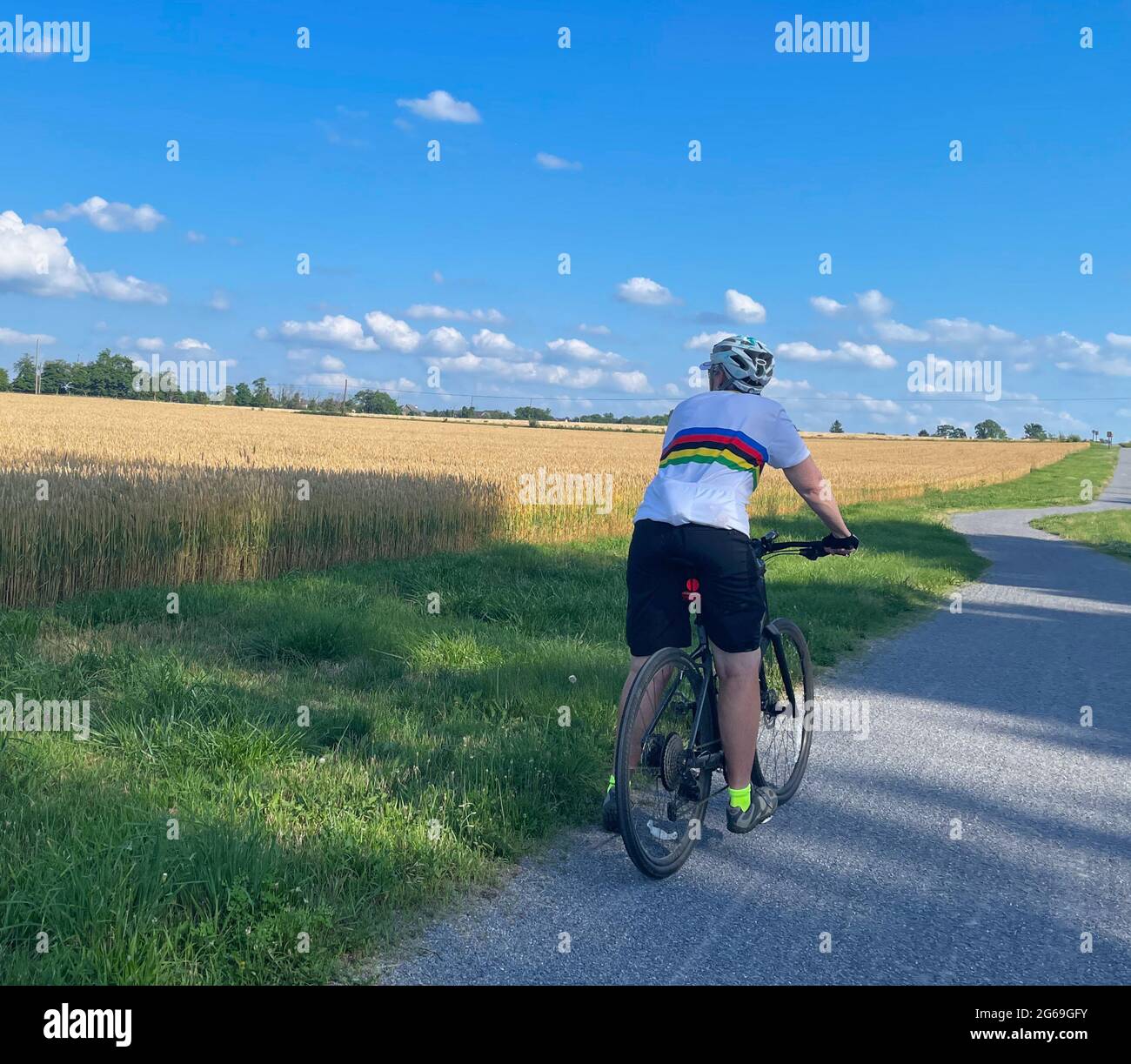 A woman admiring the wheat fields along the Union Transportation Trail ...