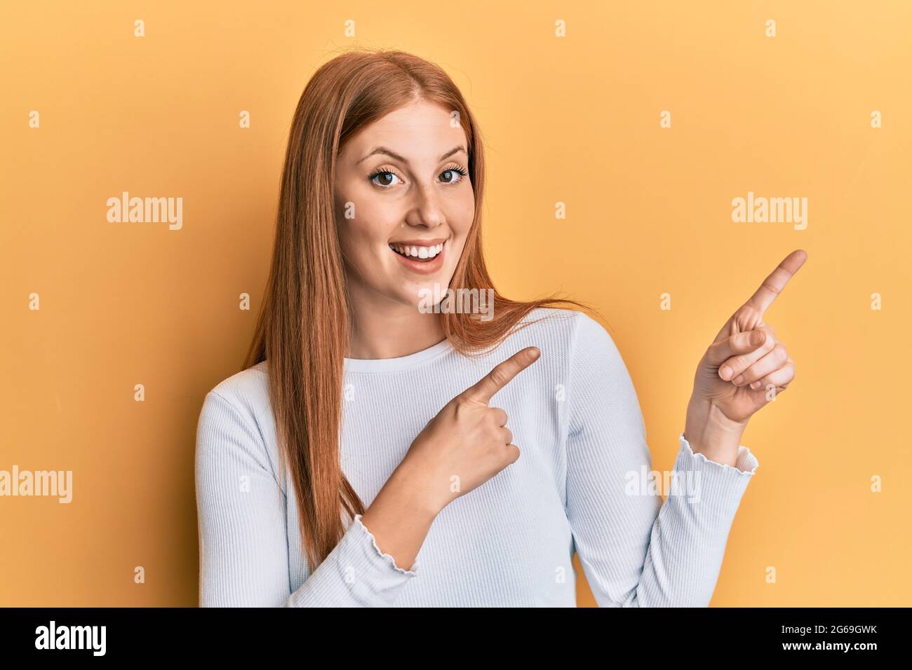 Young irish woman wearing casual clothes smiling and looking at the ...