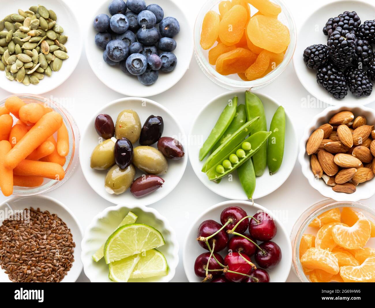 Top down view of several small dishes filled with various types of ...