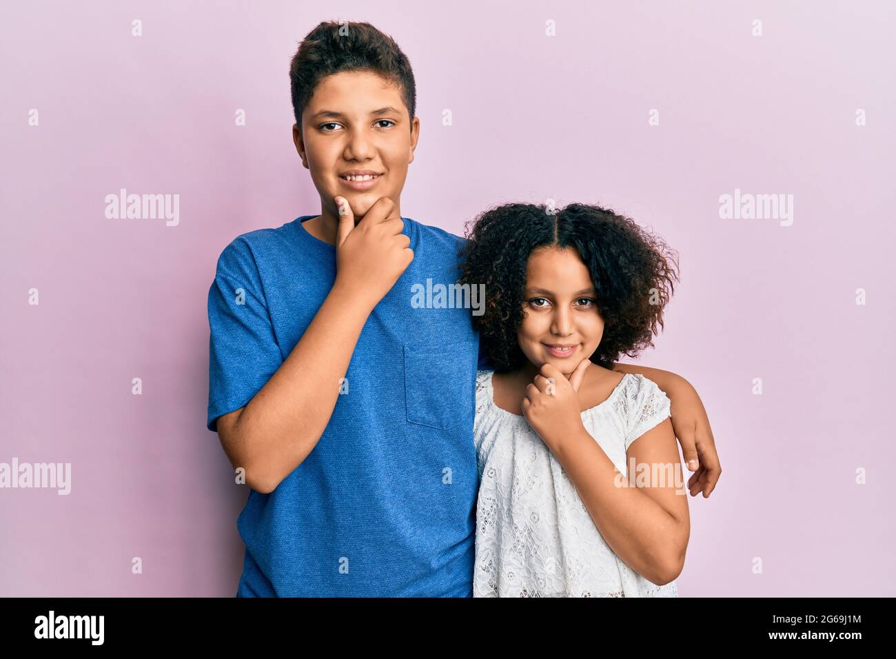 Young hispanic family of brother and sister wearing casual clothes ...