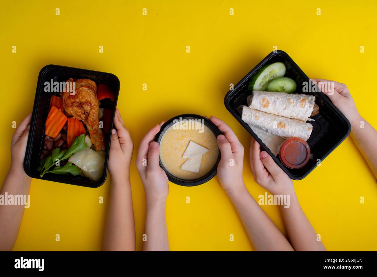 Students holding his school lunch boxes with healthy meal Stock Photo ...