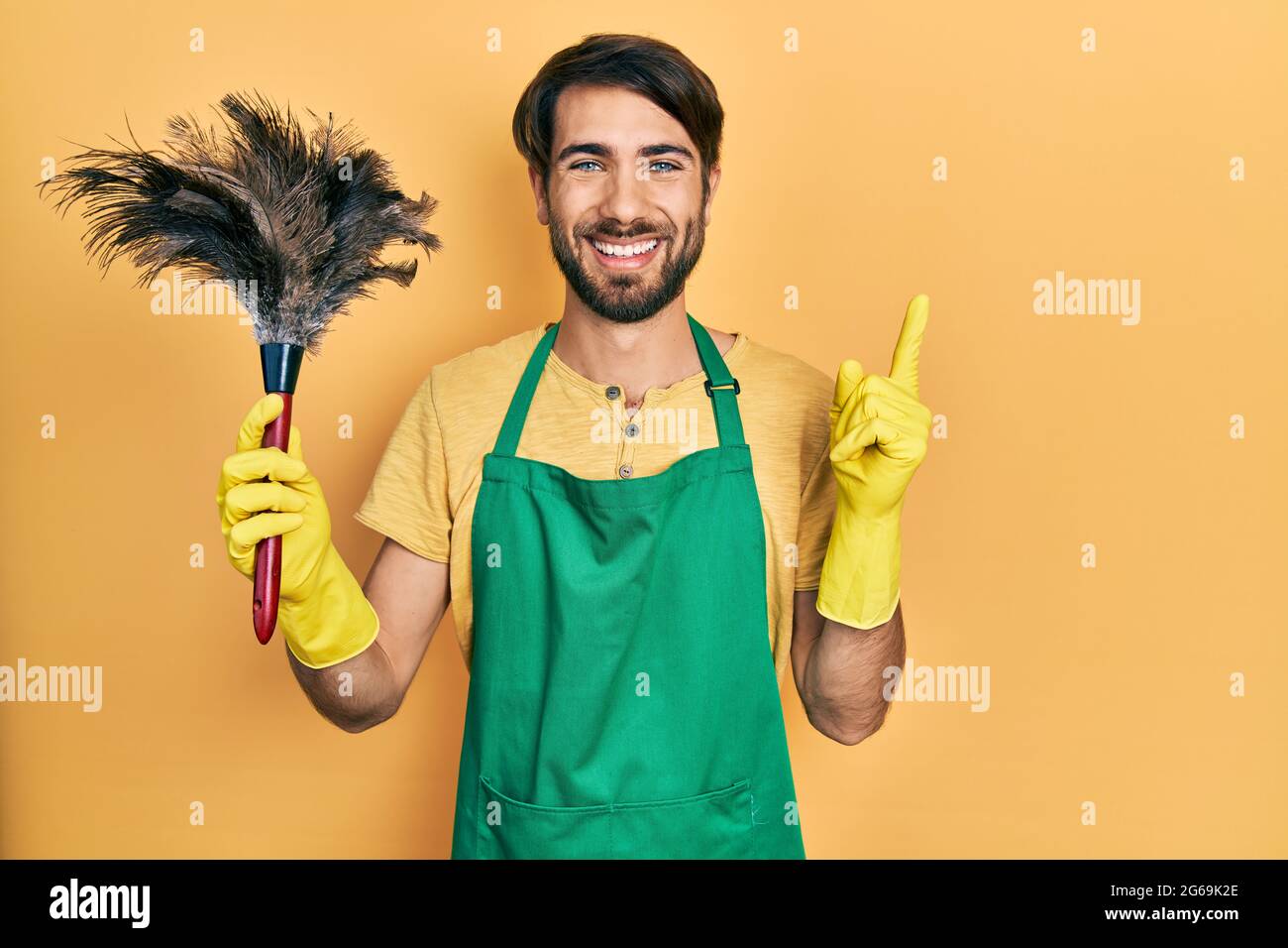 Man holding feather duster hi-res stock photography and images - Alamy