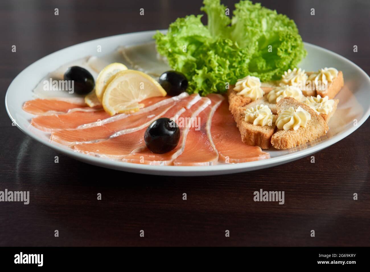 Smoked salmon served at the restaurant Stock Photo - Alamy