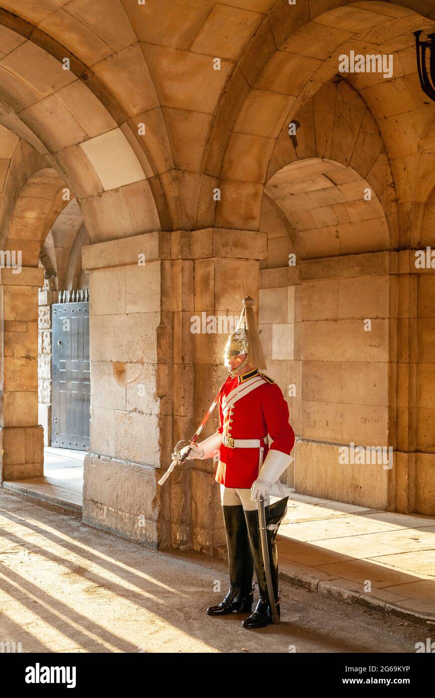 Dismounted soldier with traditional red uniform standing on duty at the ...