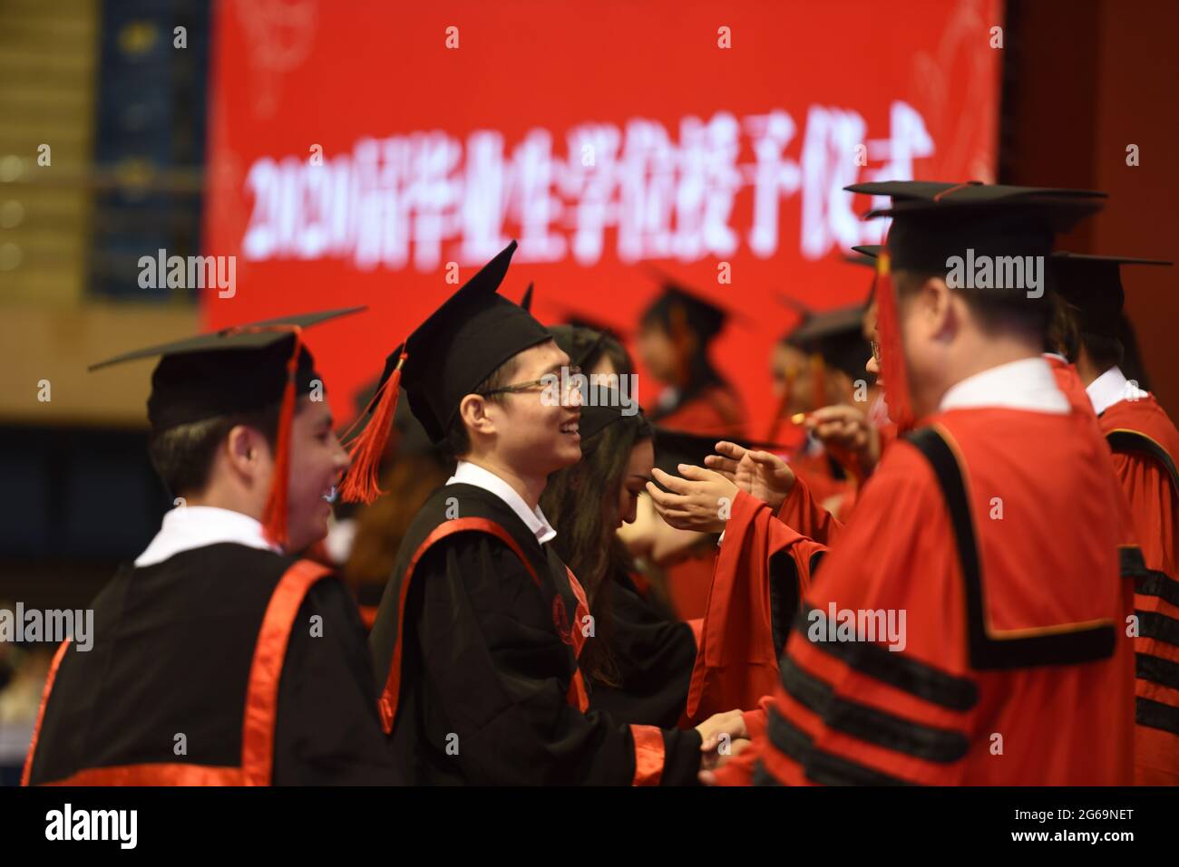 University graduates attend graduation ceremony hi-res stock ...
