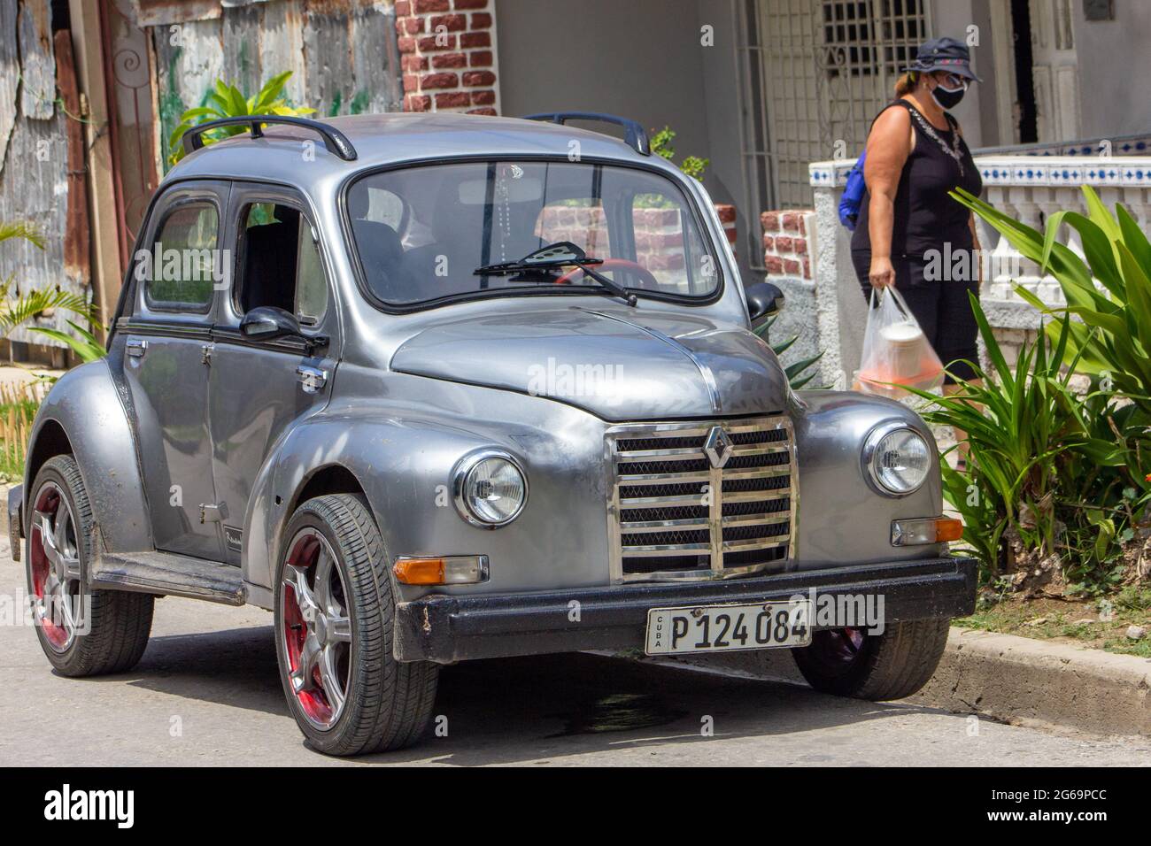Vintage car in grey metallic color and with the logo of Renault. A ...