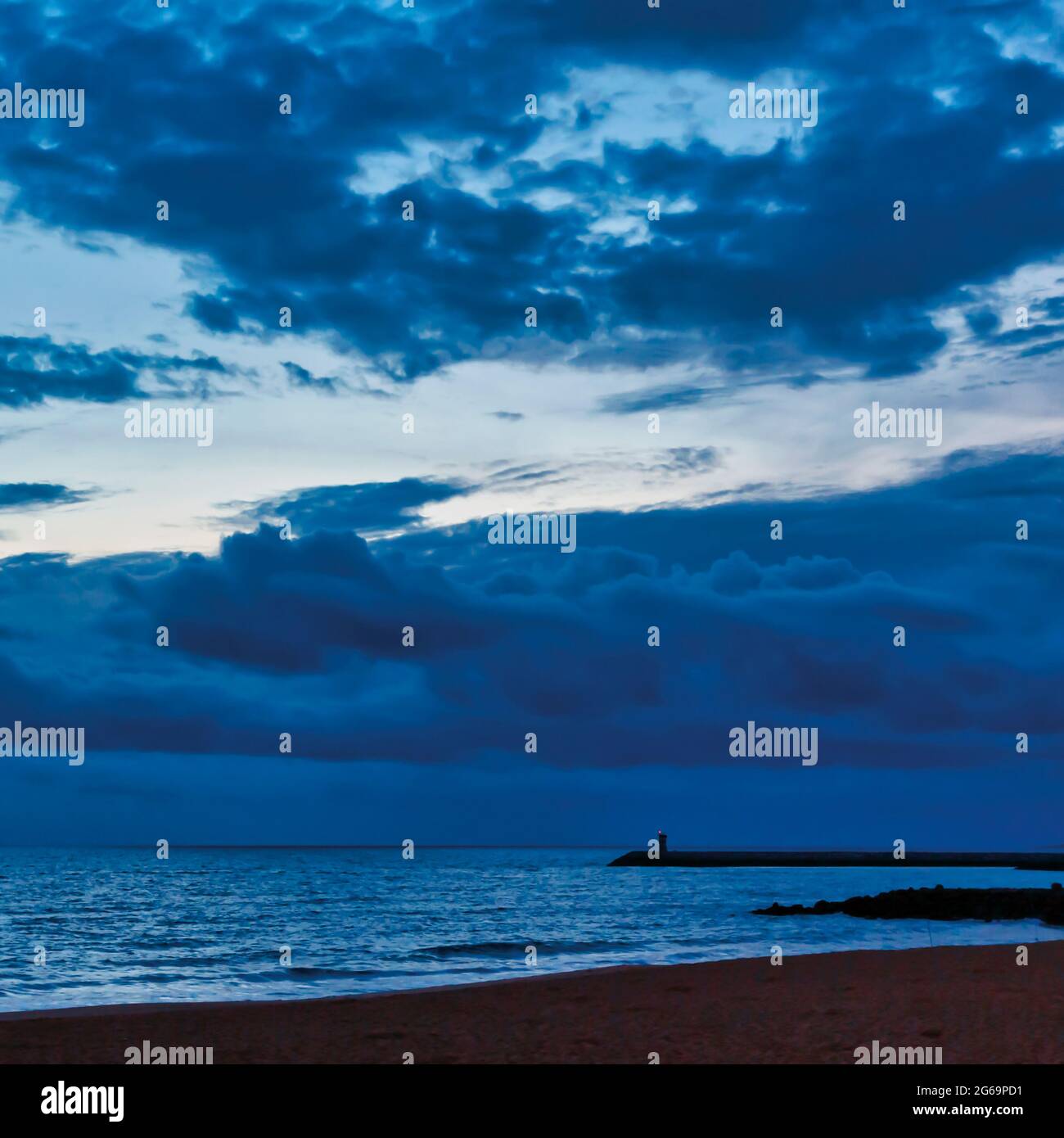 Quarteira, Algarve, Portugal. Beach at night. Red nautical navigation ...