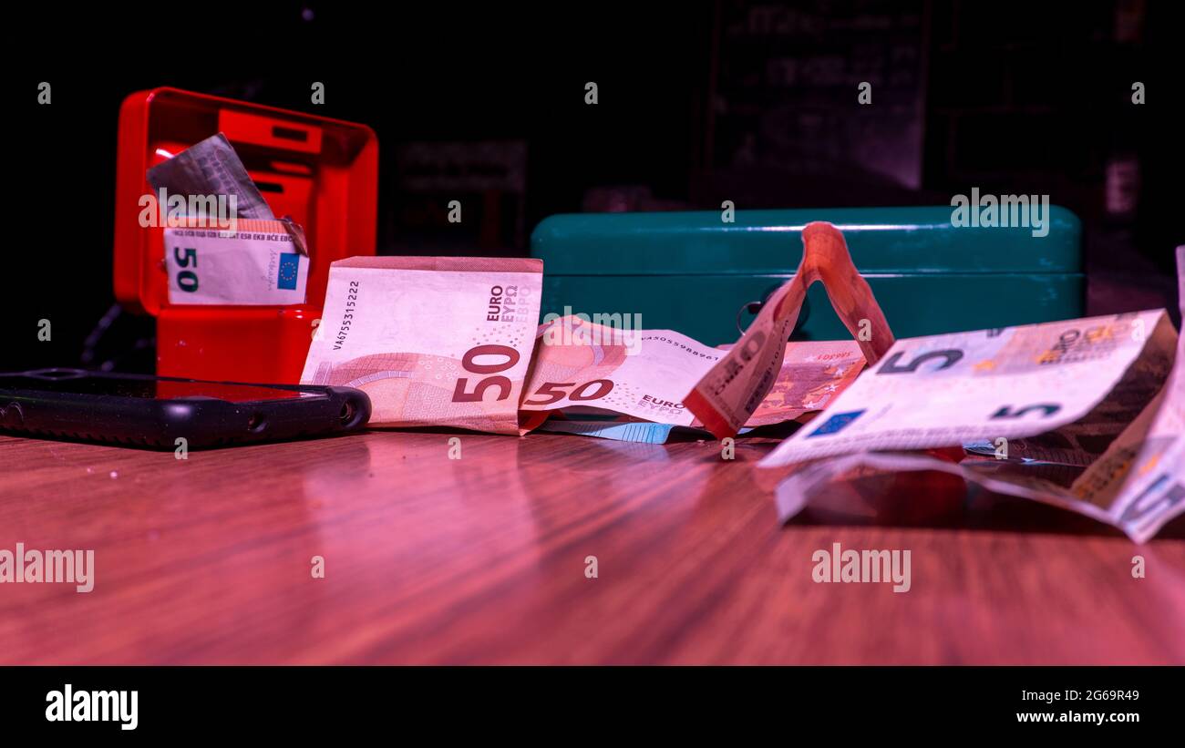 euro banknotes next to a small safe deposit box Stock Photo - Alamy