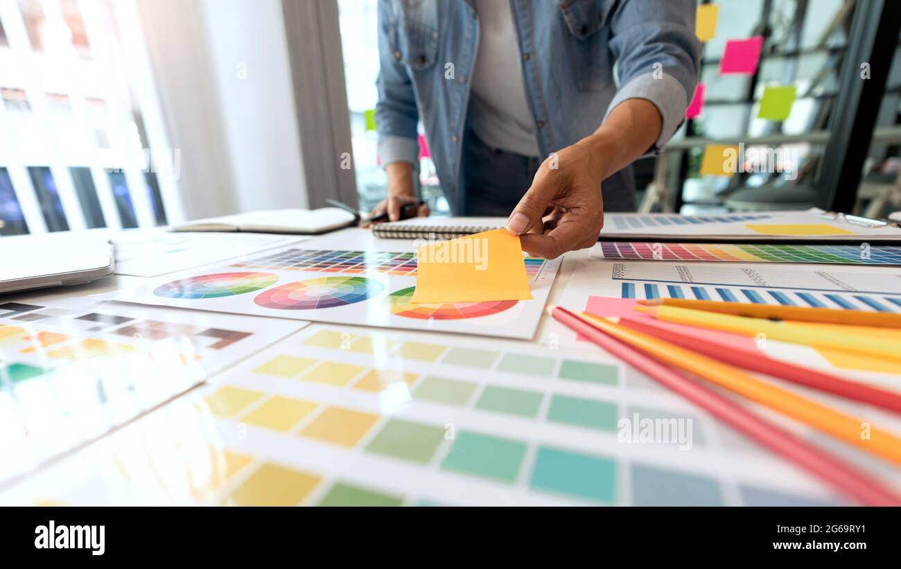 two designers discussing on the color tone for the excellent visual ...