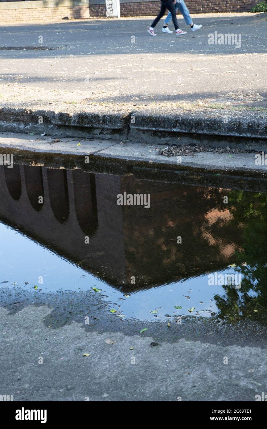 Reflection puddle brick sidewalk hi-res stock photography and images ...