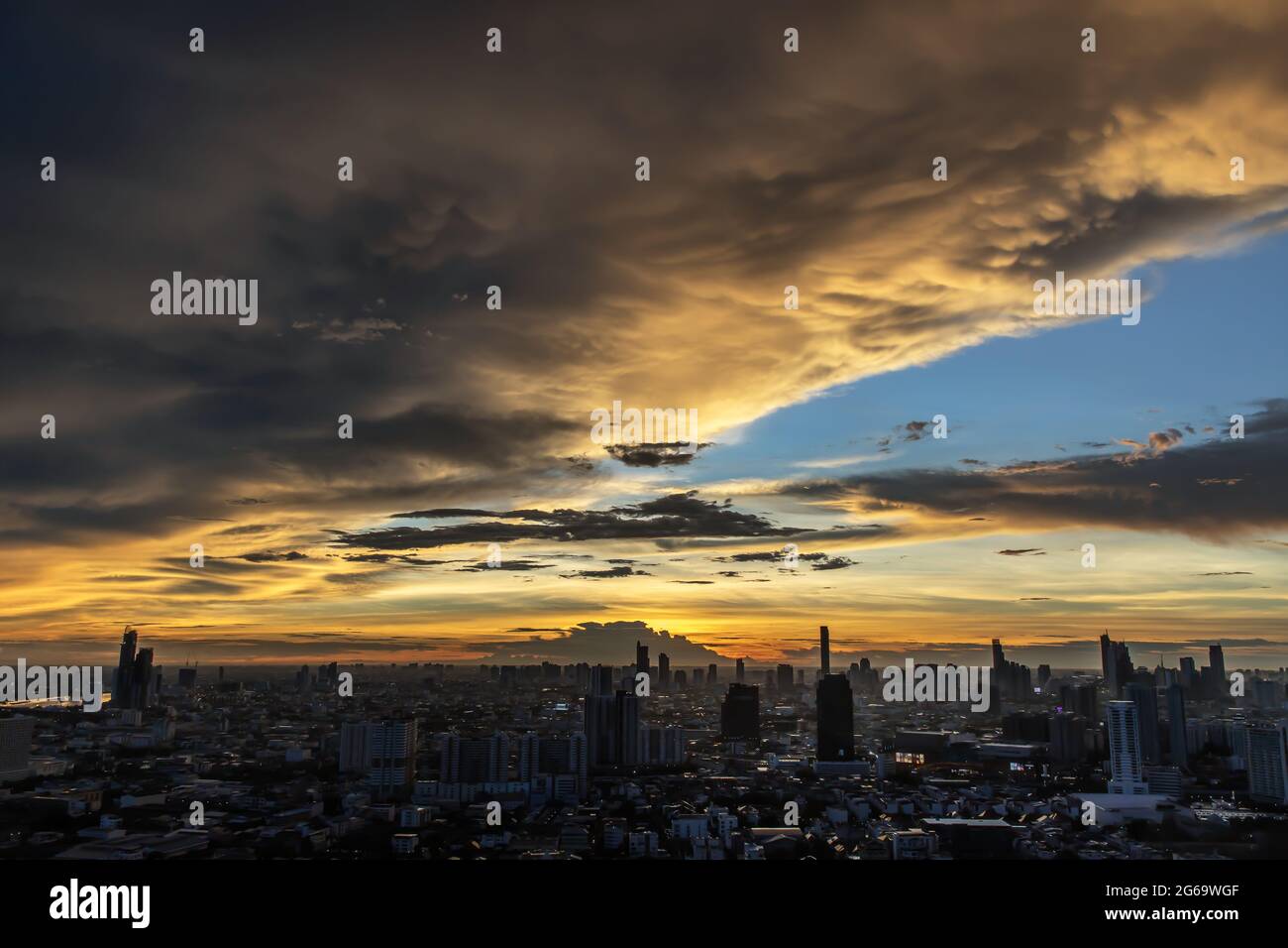 Aerial view of Beautiful sunset over large metropol city in Asia. With ...