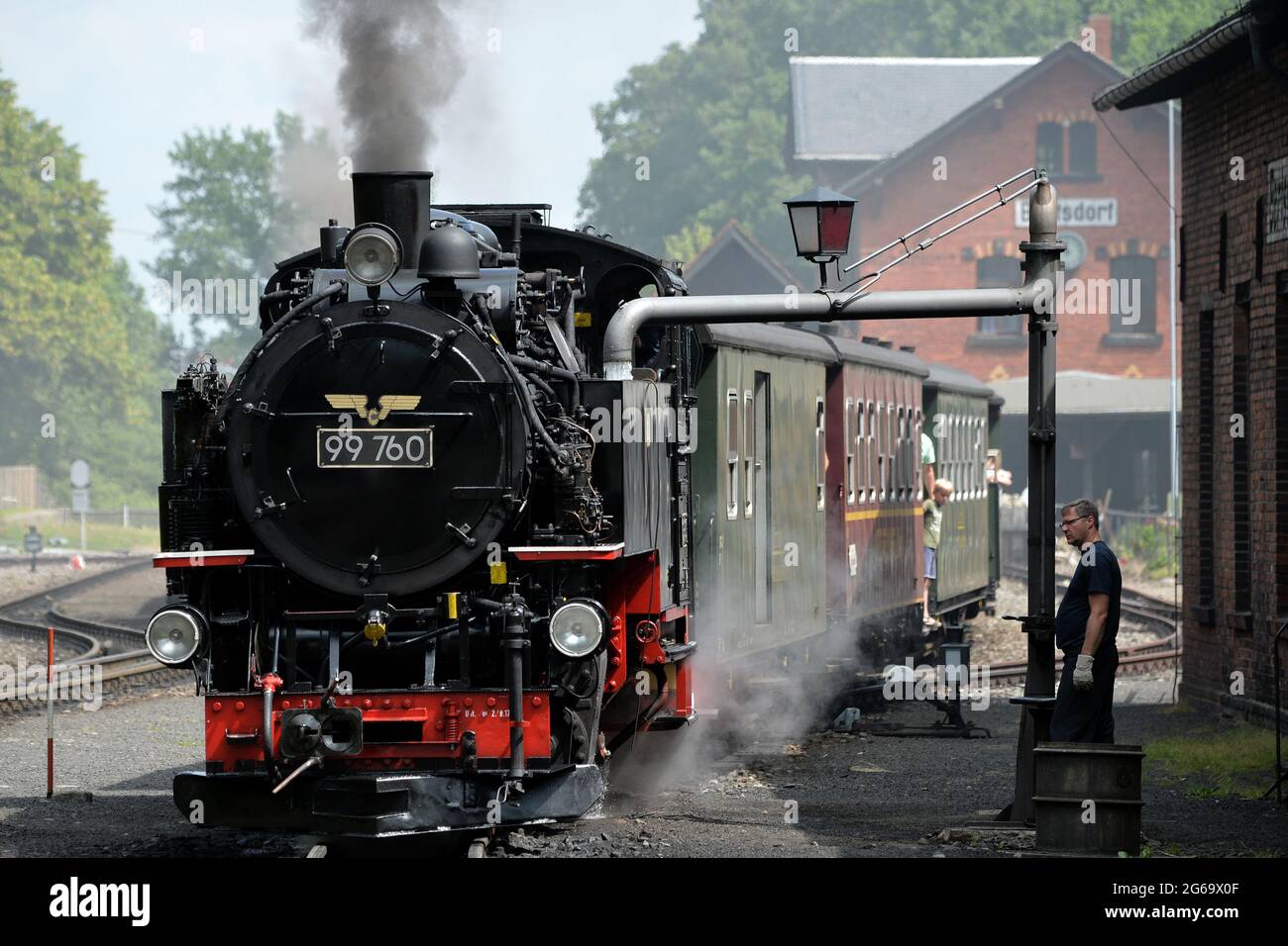July 4, 2021, Bertsdorf, Germany: Train driver filled water into a ...
