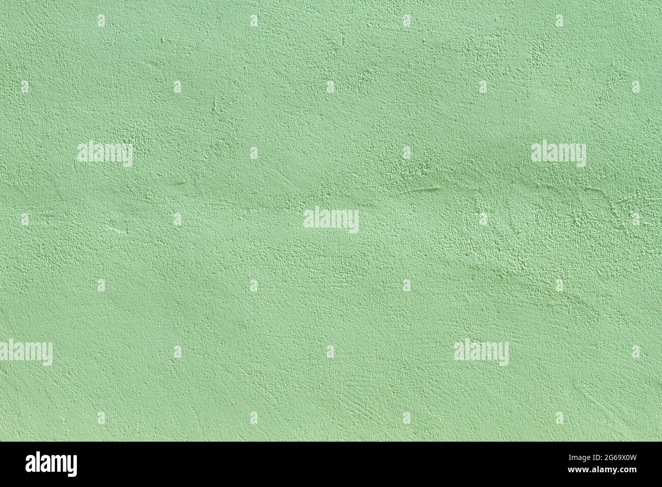 Pale green plaster finish wall texture or background Stock Photo - Alamy
