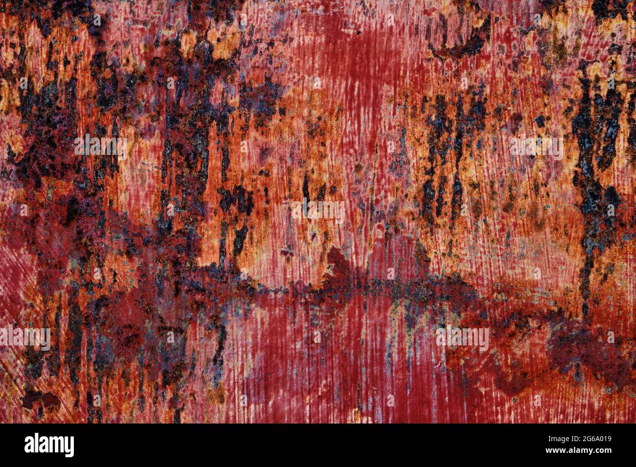 Old corroded metal with worn out red peeling paint, grunge background ...