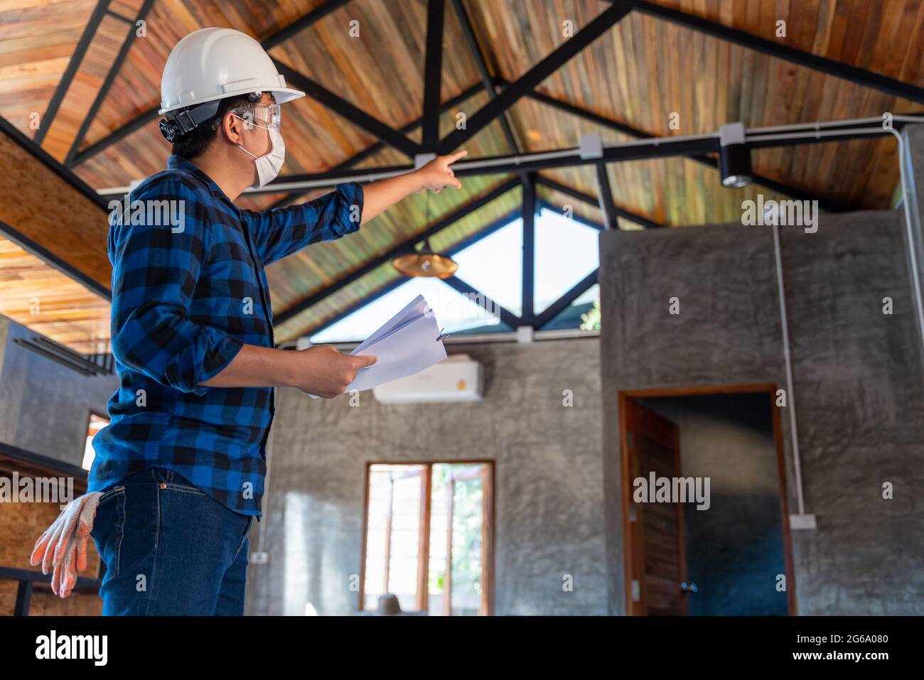 Construction engineer technician inspect the structure under the roof ...