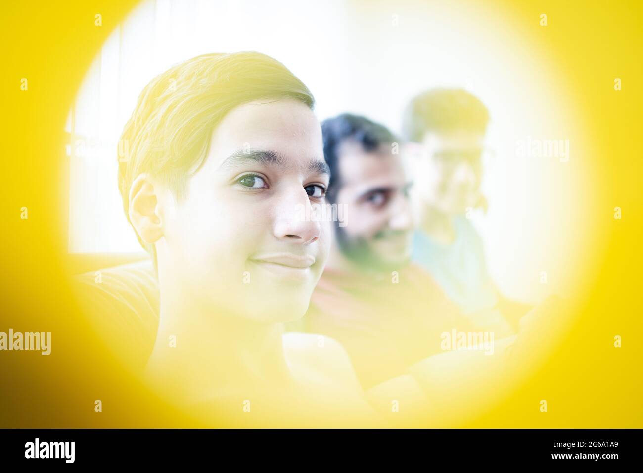 Boy smiling looking into camera Stock Photo - Alamy