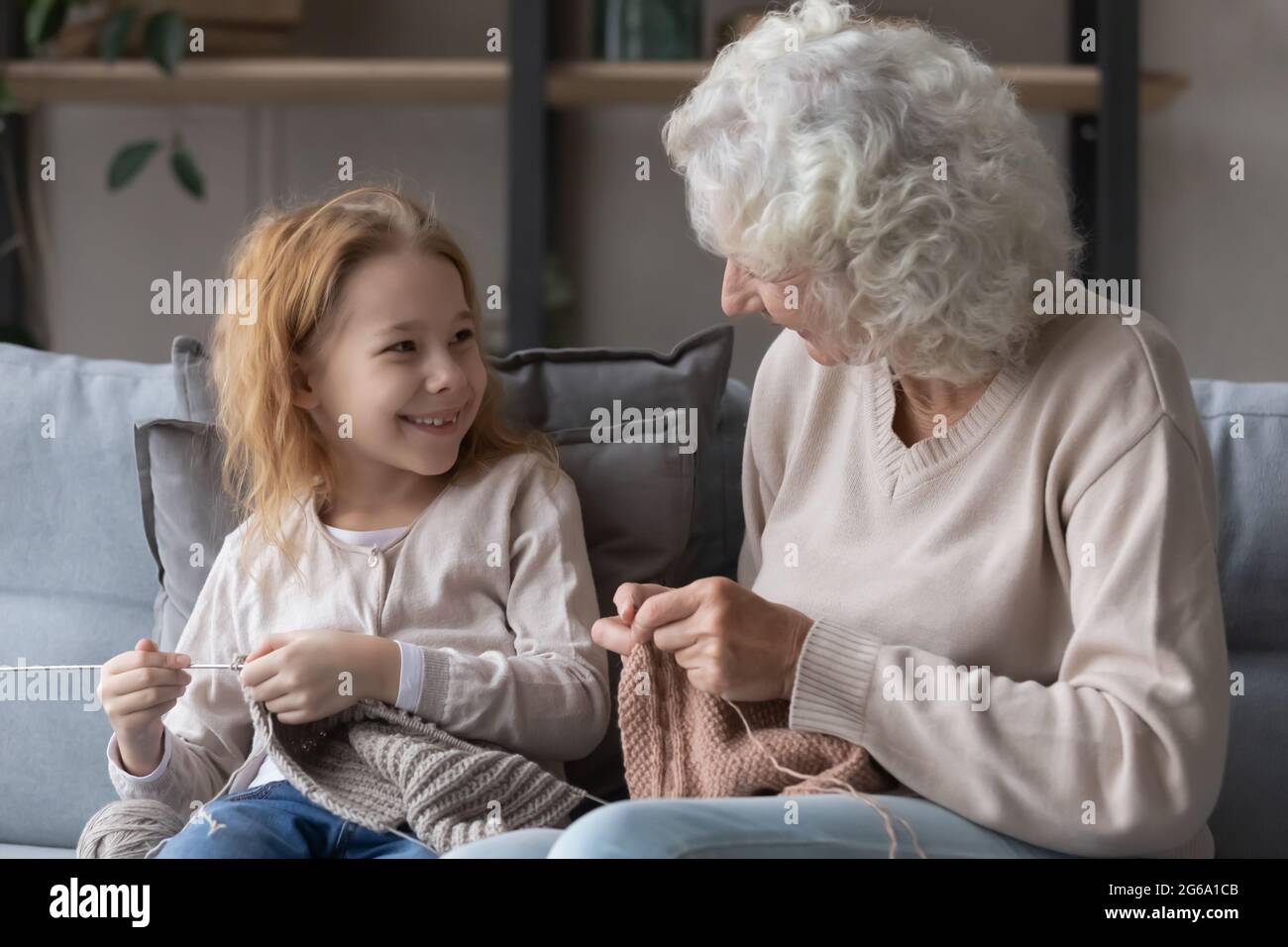 Old nanny explain little girl basics of needlework technique Stock ...