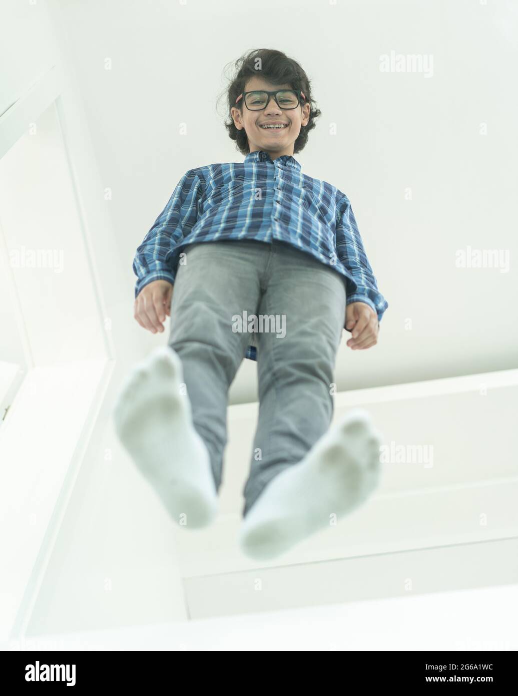 Boy smiling looking into camera Stock Photo - Alamy