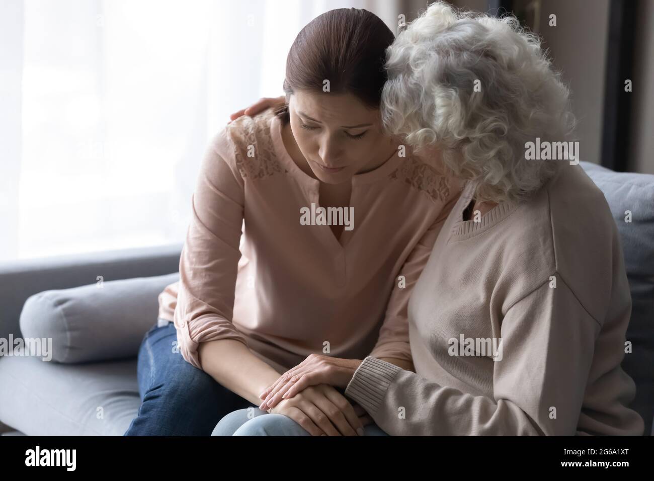 Worried old age mom support console distressed young female daughter ...