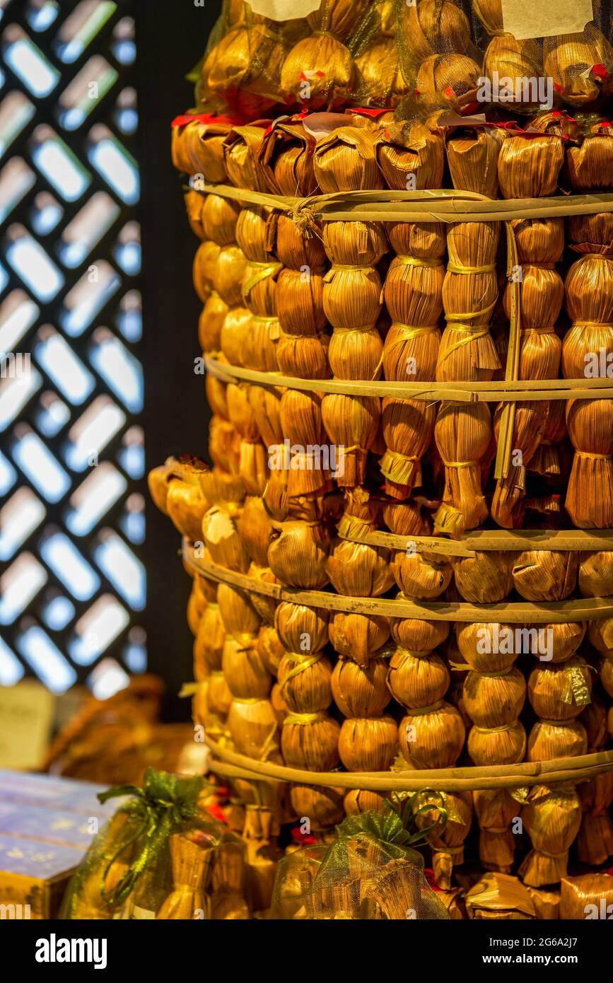 Piles of traditional Chinese Pu-erh tea bricks packed with straw Stock ...