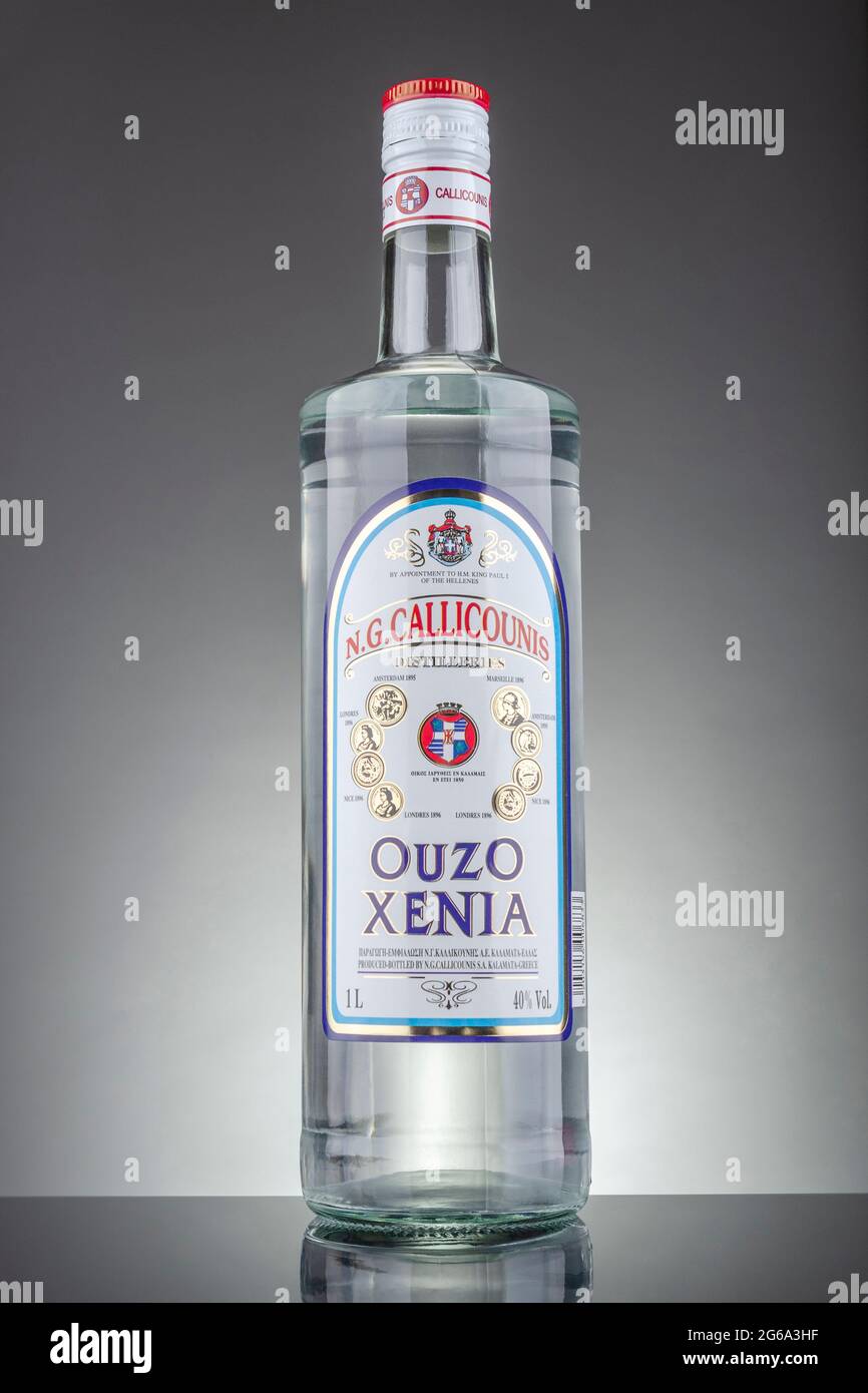 Bottle of Xenia ouzo isolated on gradient background. Ouzo is dry anise ...