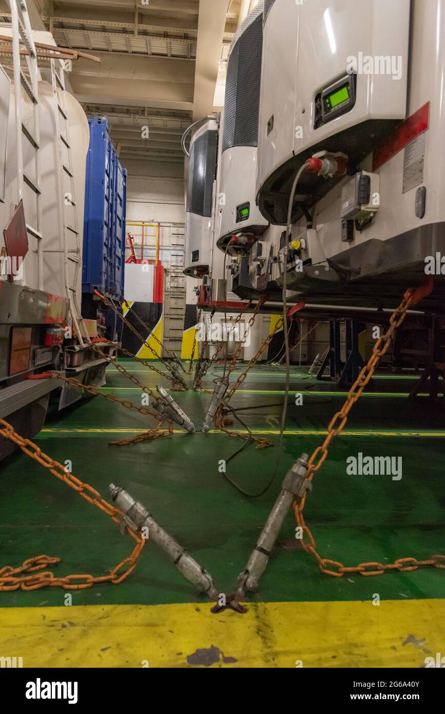 Several trailers, some refrigerated with the power cable connected to ...