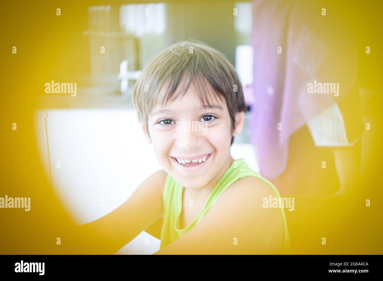 Boy smiling looking into camera Stock Photo - Alamy