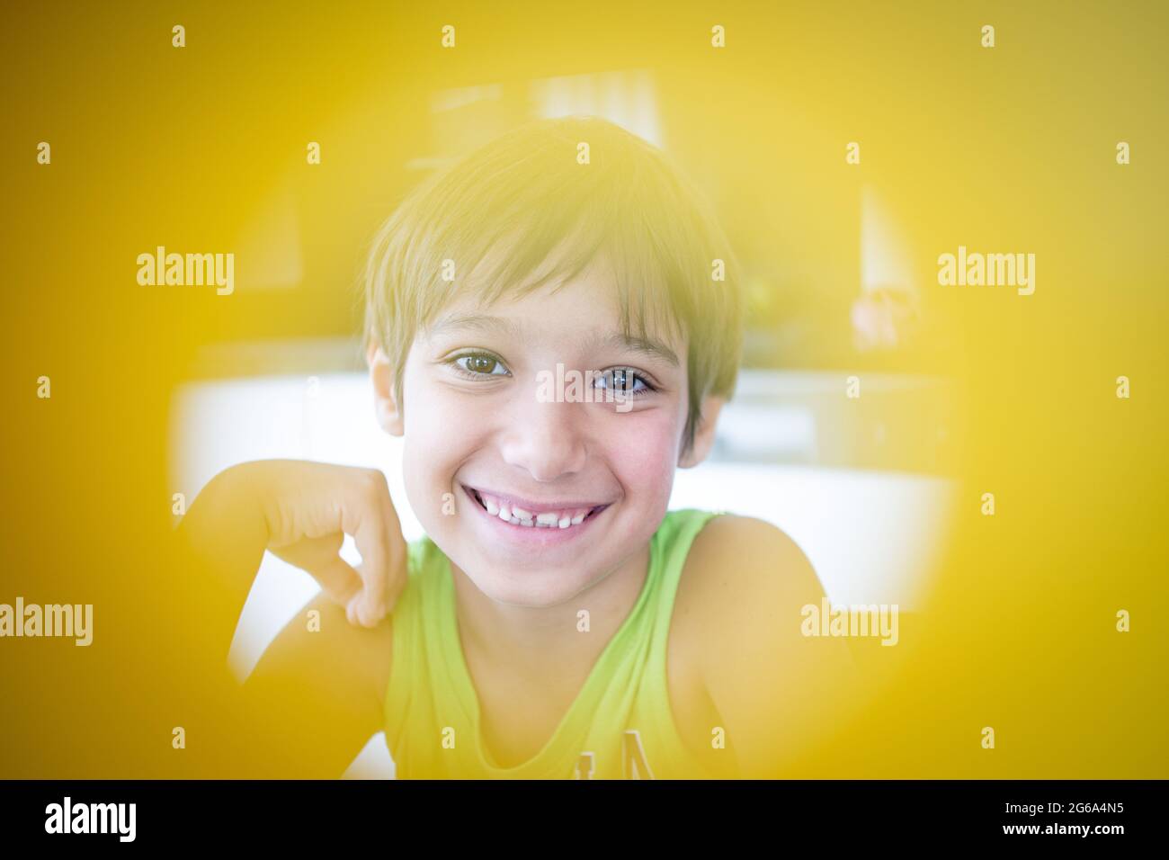 Boy smiling looking into camera Stock Photo - Alamy