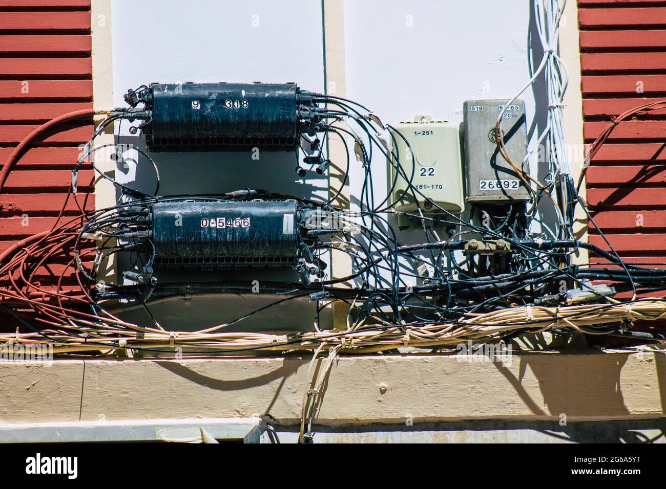 Seville Spain July 03, 2021 Electric cables on the facade of a building ...