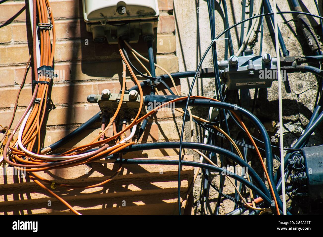 Seville Spain July 03, 2021 Electric cables on the facade of a building ...