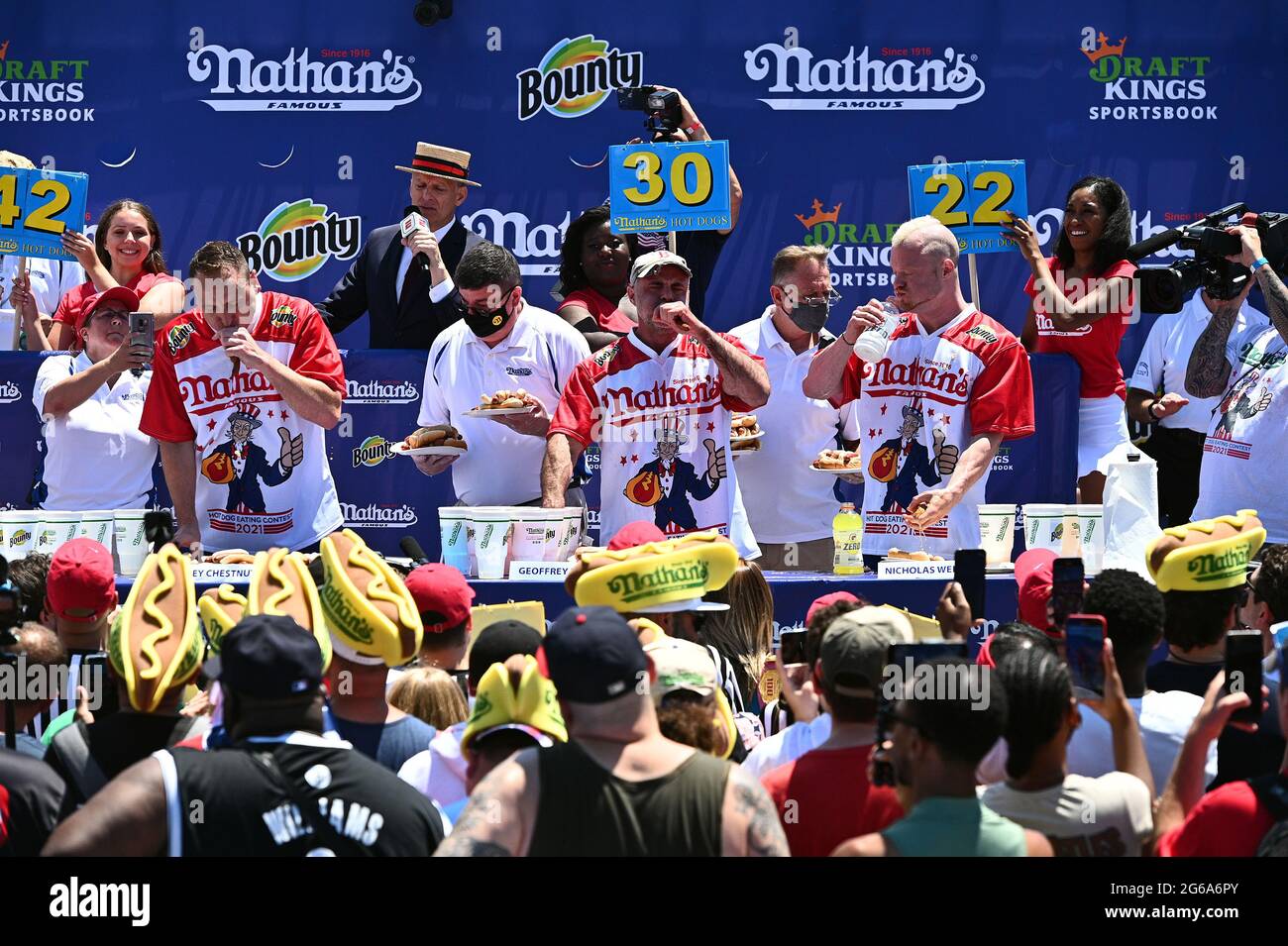 (L-R) Joey “Jaws” Chestnut , Geoffrey Esper and Nick Wehry compete in ...