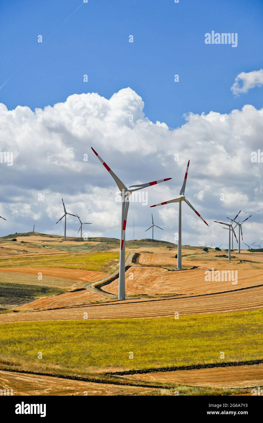 Wind turbines in the Apulian countryside in Italy Stock Photo - Alamy