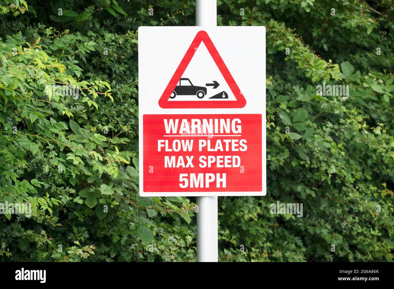 Yellow flow traffic control plates sign for one way direction of cars ...