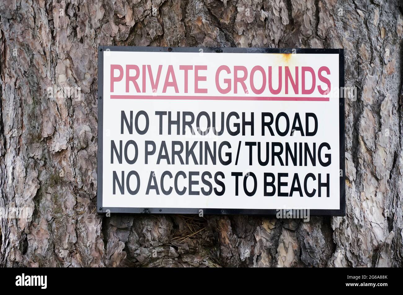 No parking private grounds sign outside house Stock Photo - Alamy