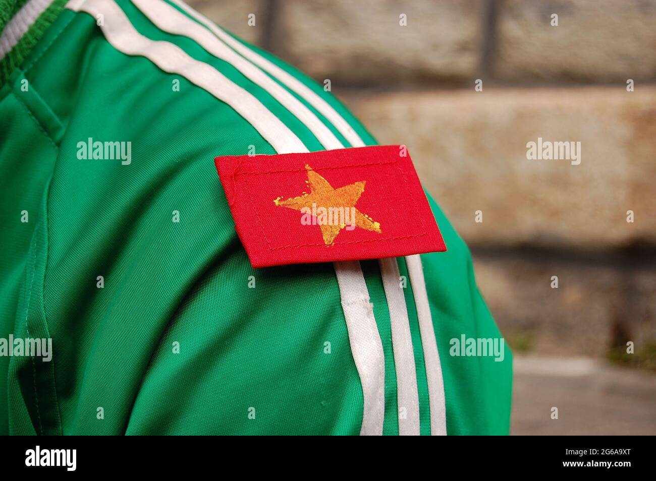 The symbol of YCL (Young Communist League) carried by a young Maoist ...