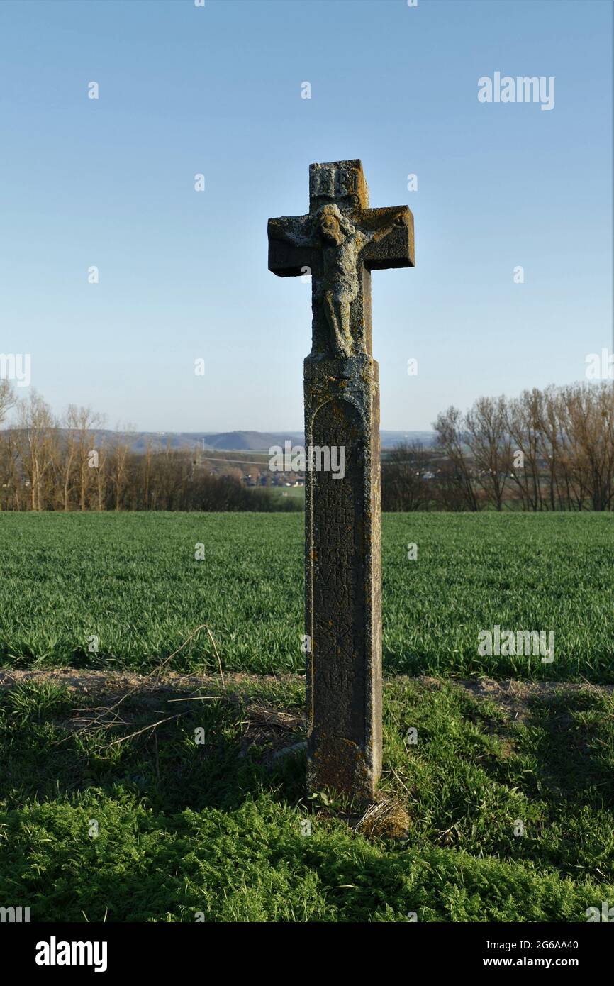 Stone Cross On The Green Field Stock Photo - Alamy