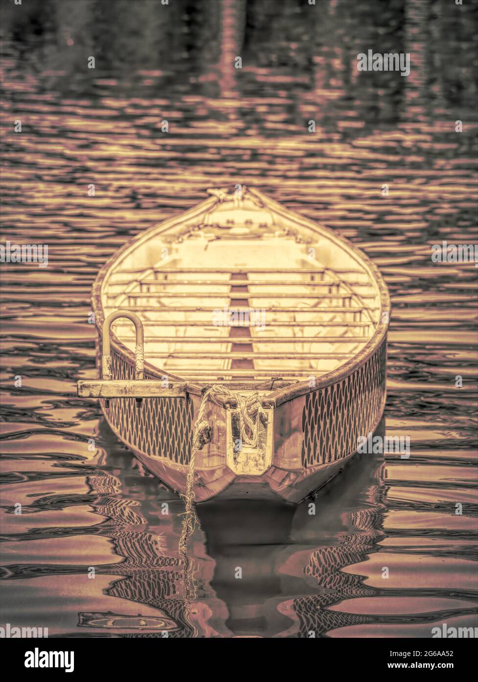 Abstract vintage picture with a golden boat floating on the water Stock ...