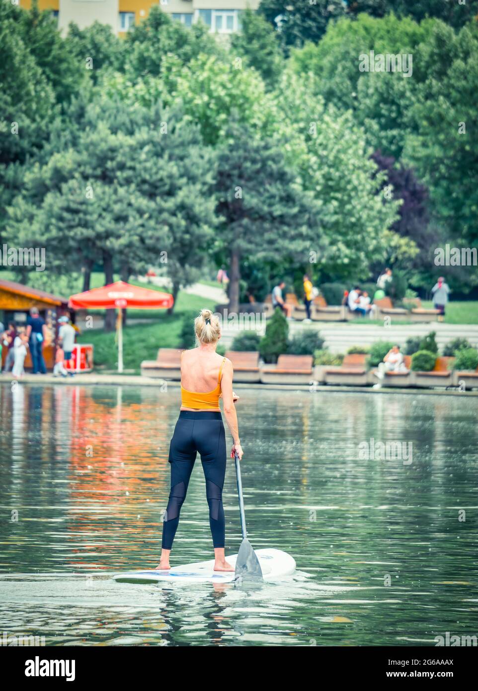Surfer girl paddling hi-res stock photography and images - Alamy