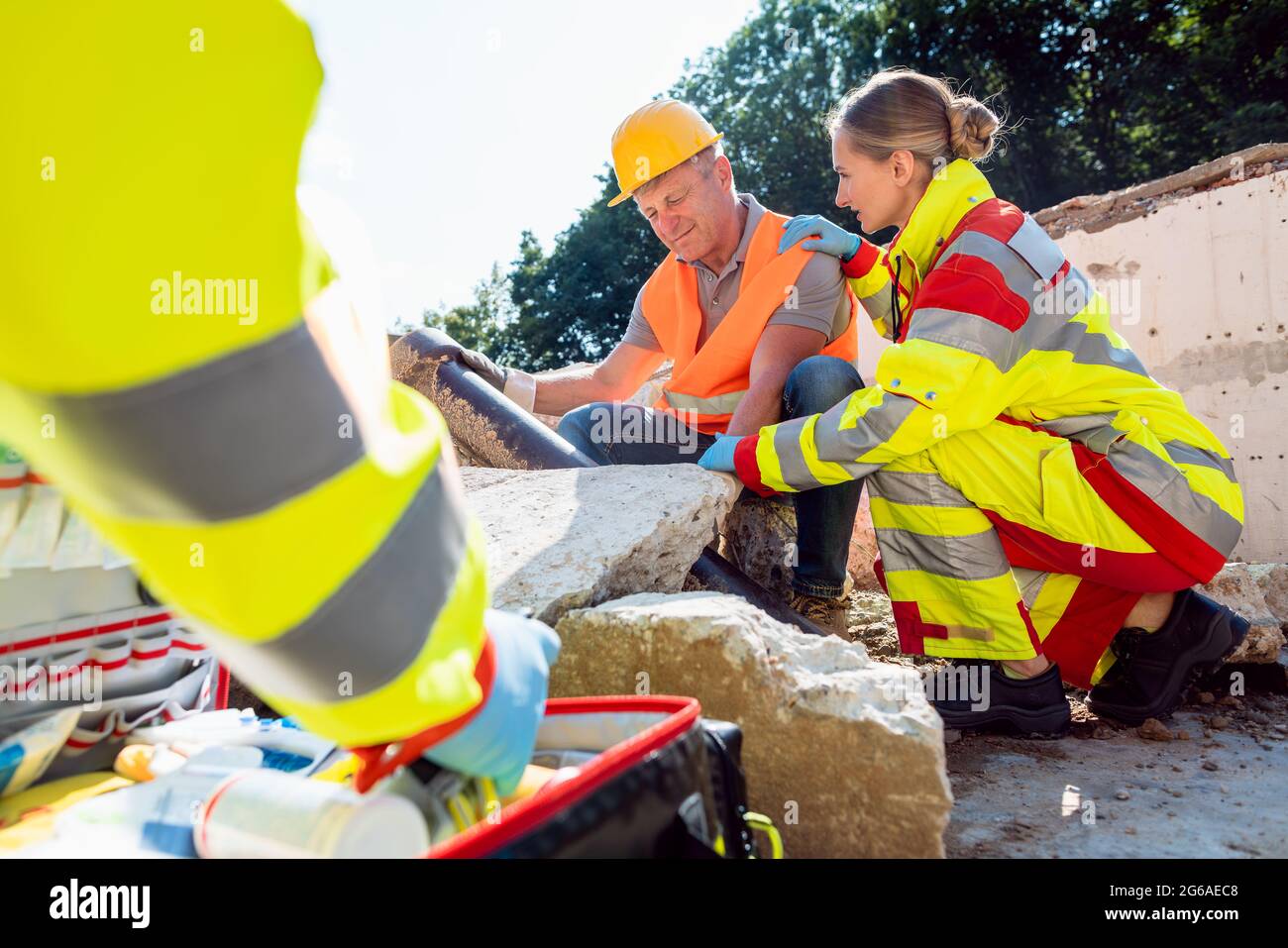 Emergency doctors giving first aid to construction worker Stock Photo ...